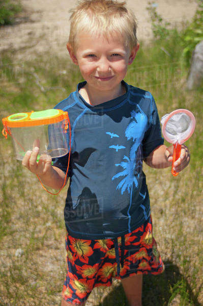 Young Boy With Bug Catcher; Lake Tahoe, California, United States of ...