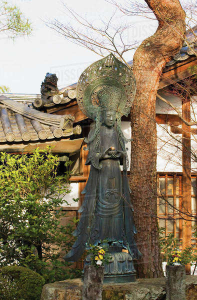 Japanese temple statue in morning light;Kyoto japan - Stock Photo ...