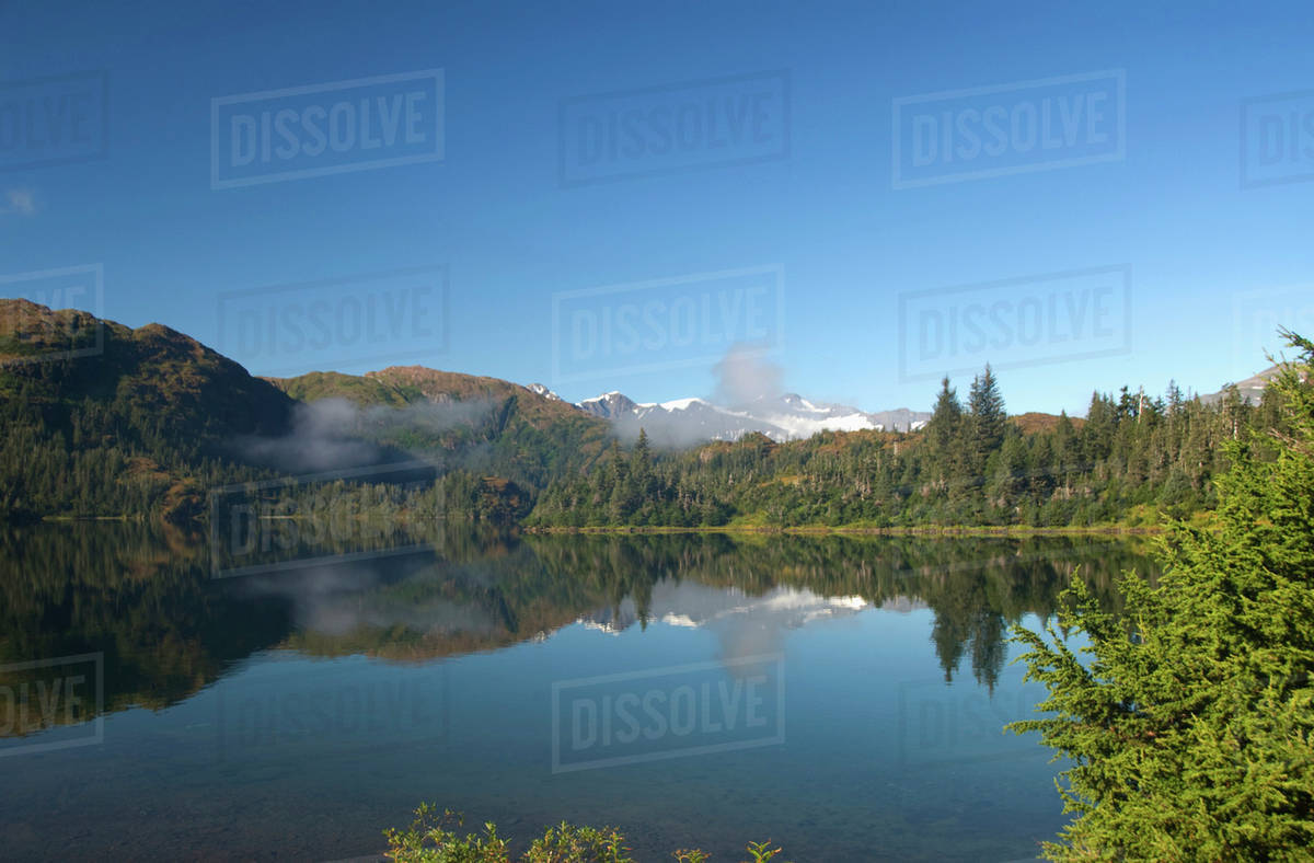 Shrode lake with low lying fog;Prince william sound alaska united ...
