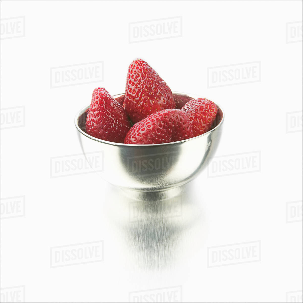 Strawberries in a stainless steel bowl on a white background - Stock ...