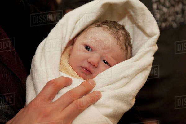 Mother Looking At Newborn Baby Girl; Edmonton, Alberta, Canada ...