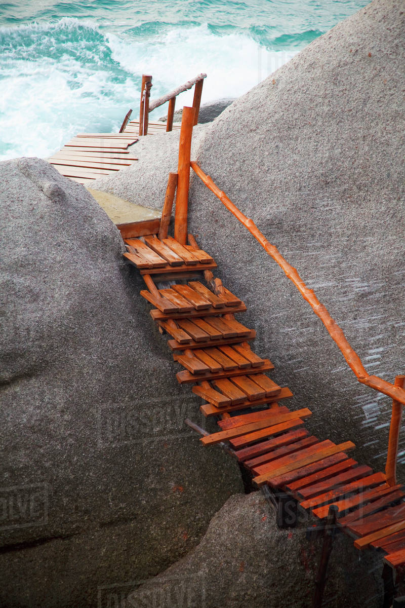 Wooden Boardwalk On The Rocks Along The Ocean; Koh Tao Thailand ...