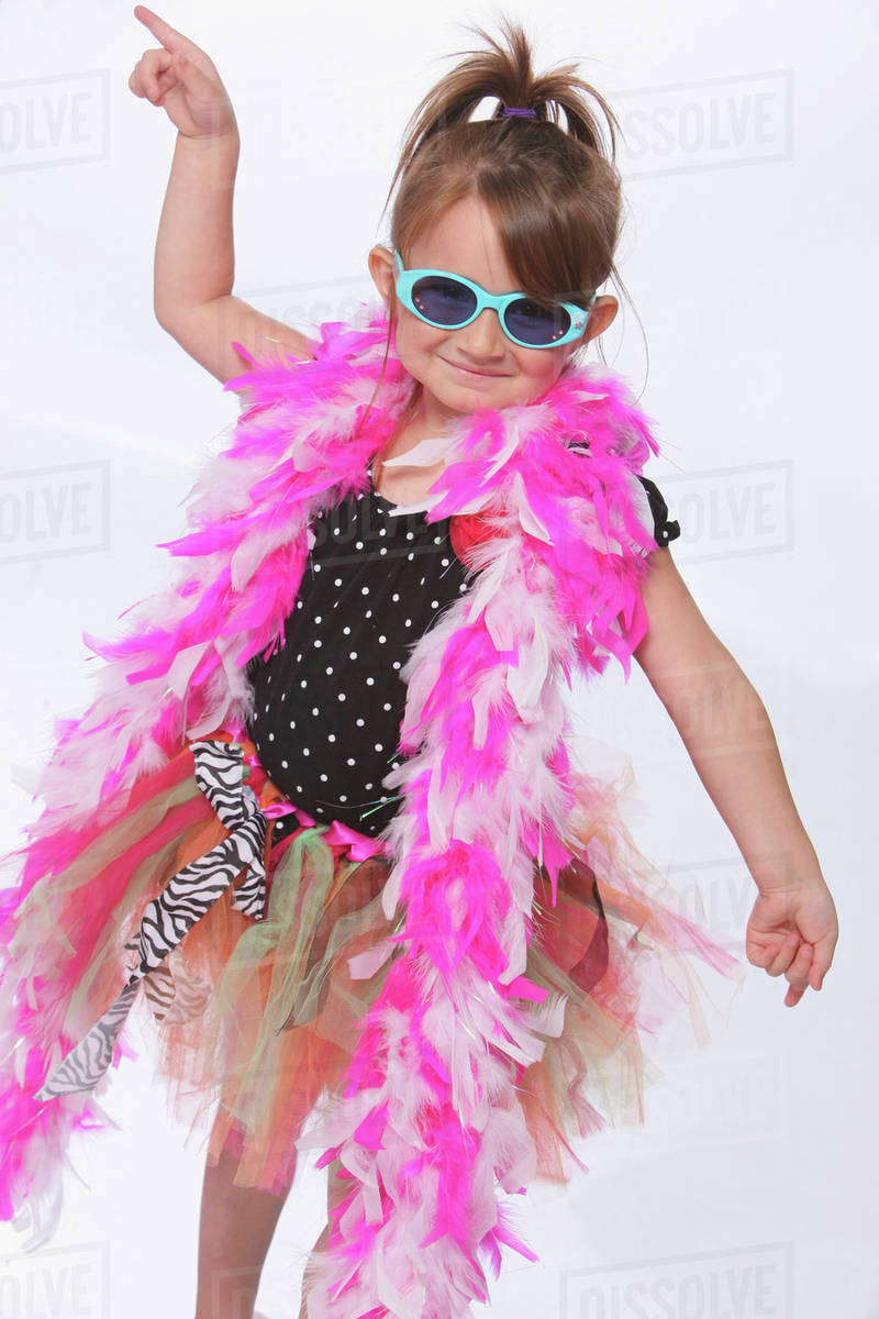 A Young Girl Dancing In Crazy Dress Up Clothes With Sunglasses ...