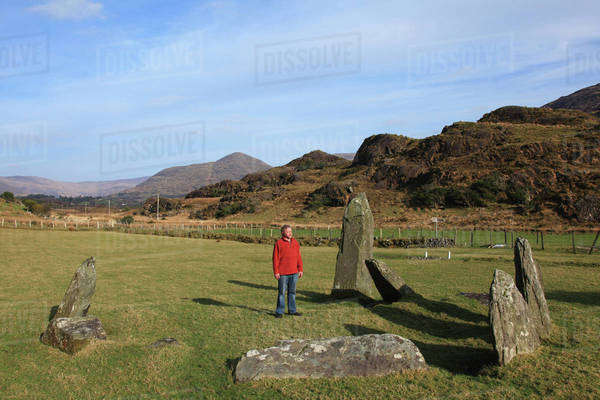 A Man Stands In A Stone Circle; Lauragh, County Kerry, Ireland ...