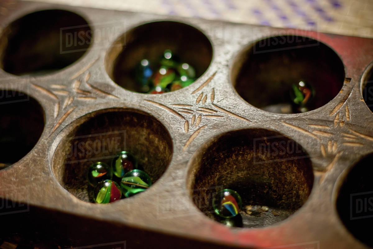 The Game Congkak; Melaka, Malaysia - Stock Photo - Dissolve