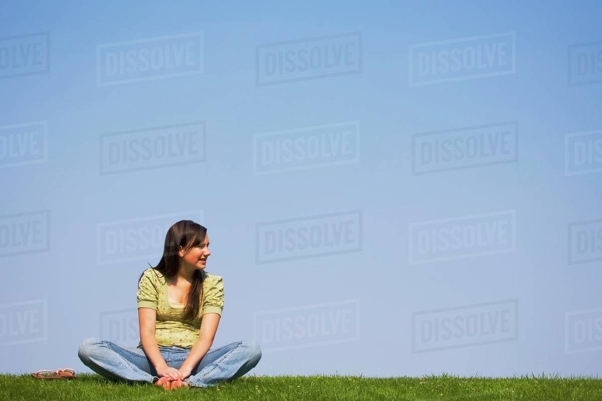 A Girl Sitting On The Grass - Royalty-free Stock Photo | Dissolve