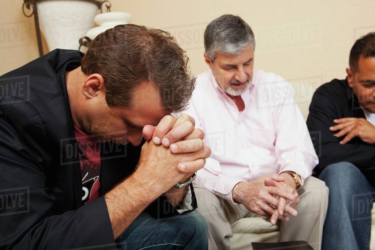 Men Praying Together - Royalty-free Stock Photo | Dissolve