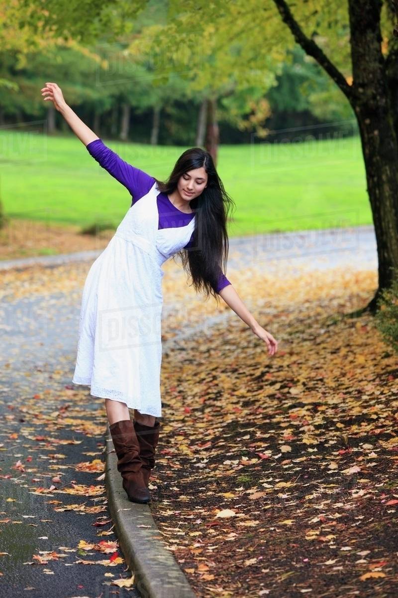 A Teenage Girl Walking On A Curb In Autumn - Royalty-free Stock Photo ...