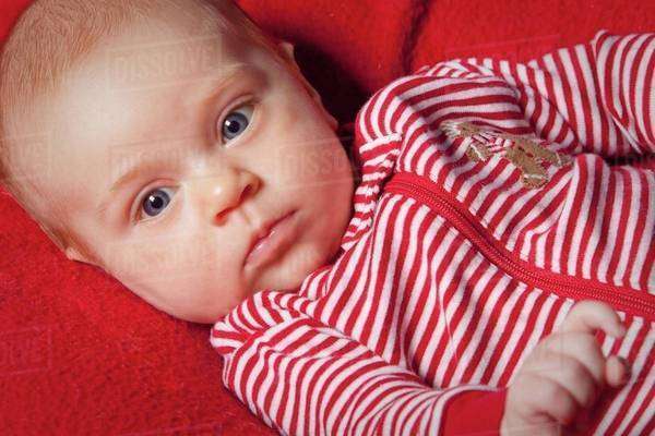 An Infant Wearing Red And White - Royalty-free Stock Photo | Dissolve