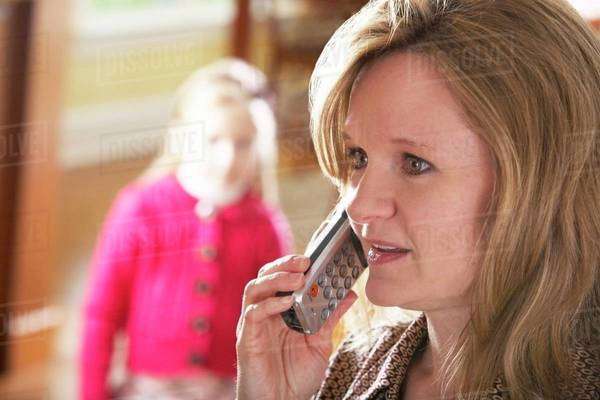 A Mother Talking On The Phone - Stock Photo - Dissolve