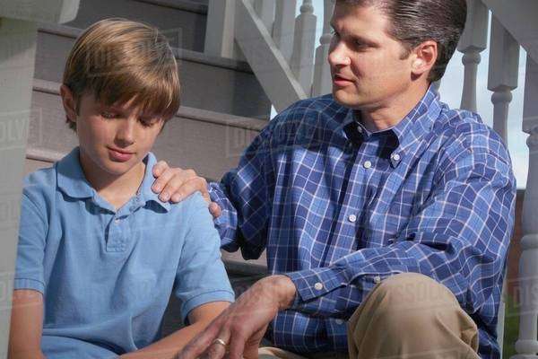 A Father Praying With His Son - Royalty-free Stock Photo | Dissolve