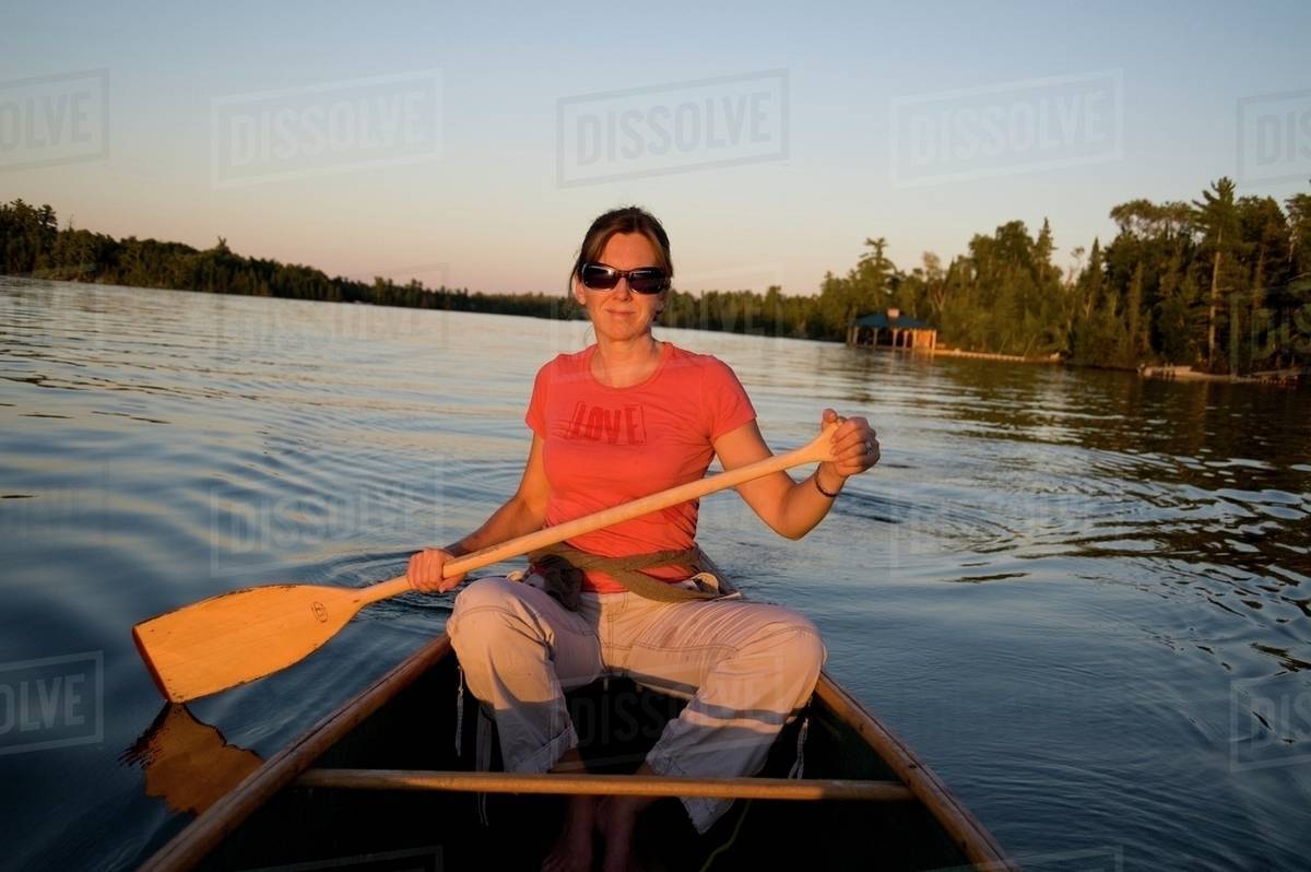 Woman Canoeing - Stock Photo - Dissolve