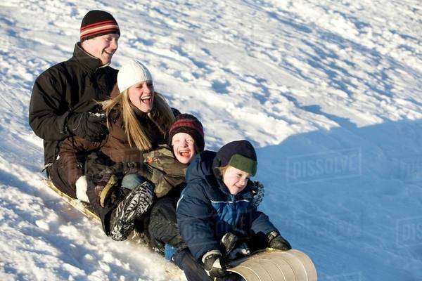 Family Tobogganing - Royalty-free Stock Photo | Dissolve