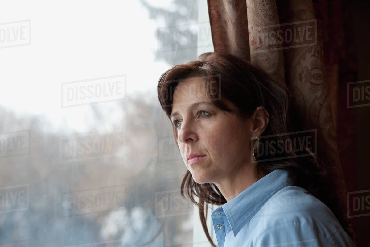 Woman Leaning On Window - Royalty-free Stock Photo | Dissolve