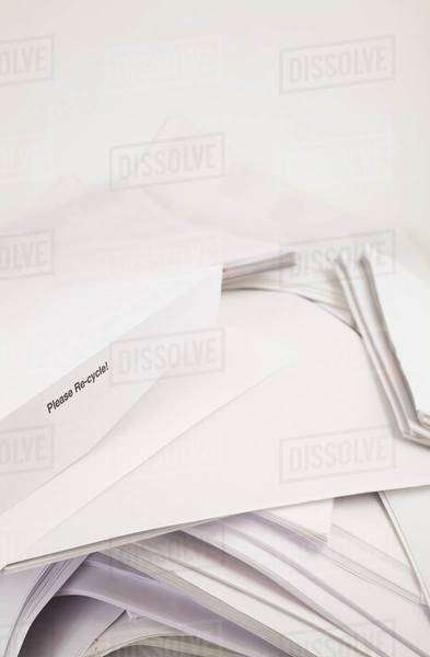 Please Recycle Notice On Top Of A Pile Of Stapled Sheets Of White ...