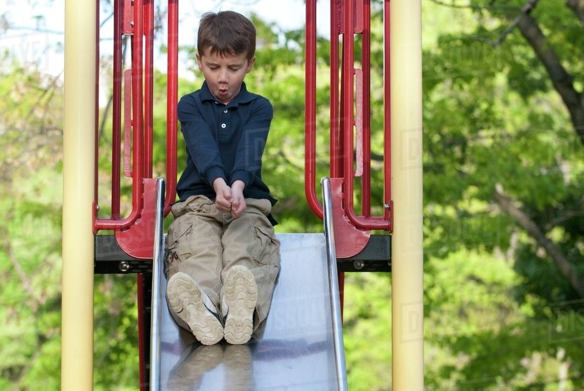 Boy On A Slide - Royalty-free Stock Photo | Dissolve
