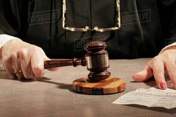 Judge Using A Gavel - Royalty-free Stock Photo | Dissolve