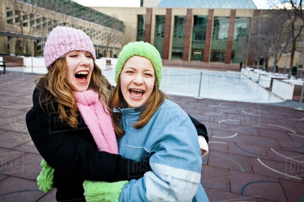 Two Friends Laughing Together - Stock Photo - Dissolve