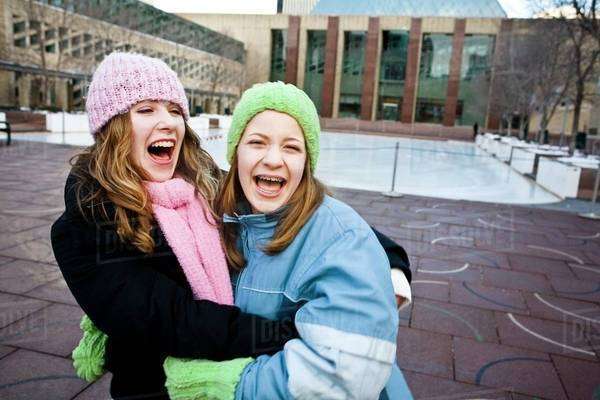 Two Friends Laughing Together - Stock Photo - Dissolve