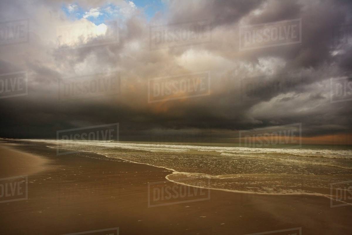 Storm Clouds Over Beach - Royalty-free Stock Photo | Dissolve