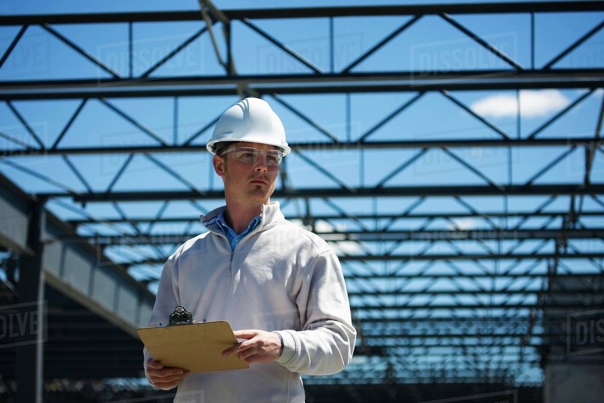 Engineer With Clipboard On Construction Site - Royalty-free Stock Photo ...