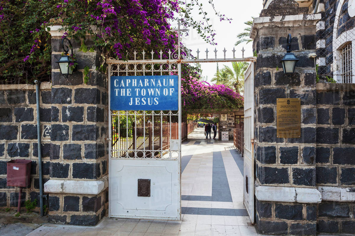 Present day entrance to the historic village of Capernaum with a sign ...