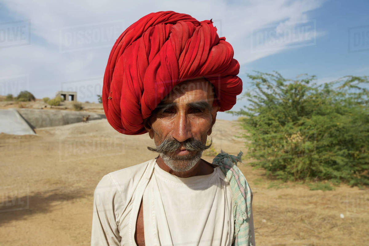 Traditionally dressed nomadic Rabari shepherd with coiled turban and ...