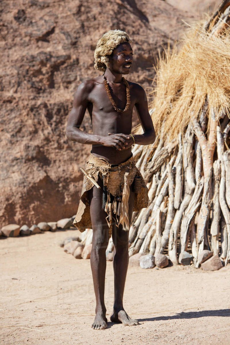A young man in traditional Damara People clothes is posing at The ...