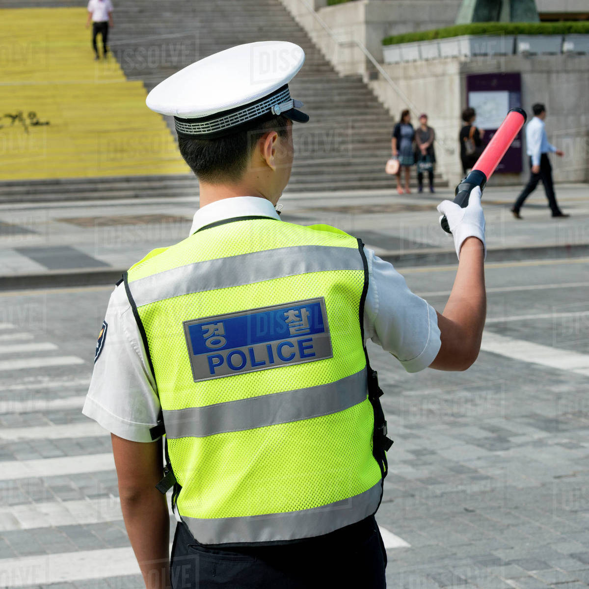 Policeman directing traffic at a crosswalk; Seoul, South Korea - Stock ...