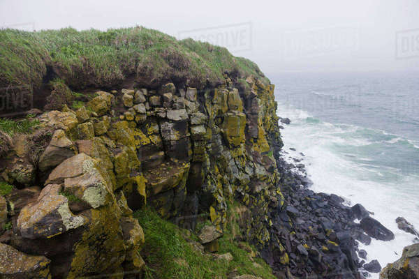 Eroding coastal cliffs of St. Paul Island along the Bering Sea, St ...