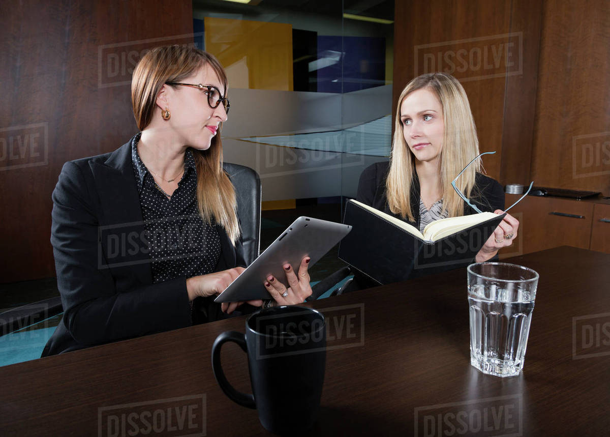 Two professional business women during a training session in a ...