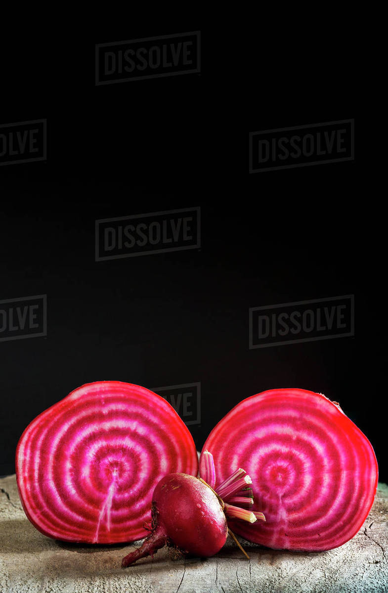 Close Up Of A Cut Red And White Striped Beet With An Uncut Small Beet ...