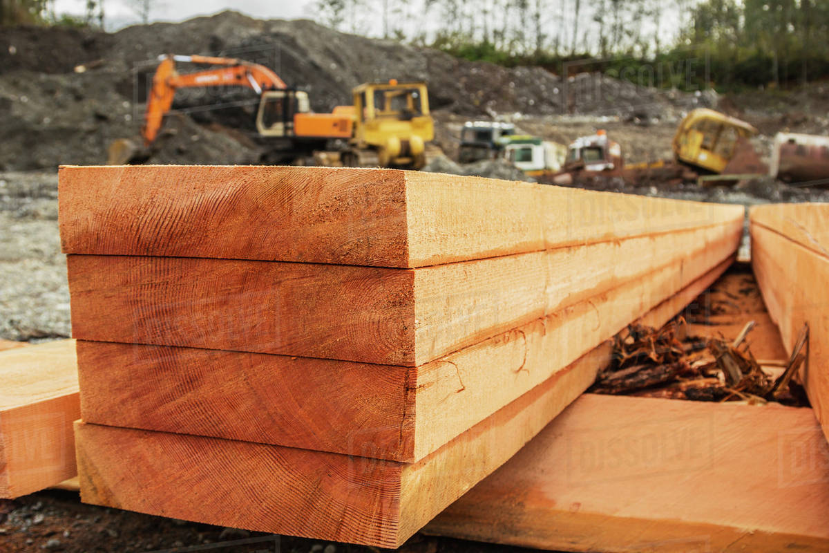 A neat stack of fresh lumber is shown on a side profile revealing the ...
