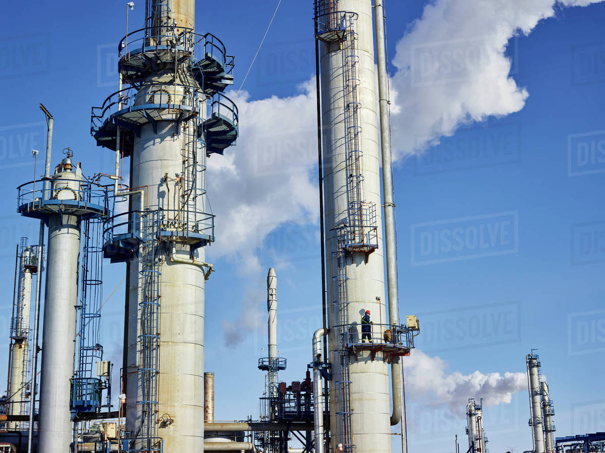 A Tradesman Working On A Tower Platform At A Refinery; Edmonton ...