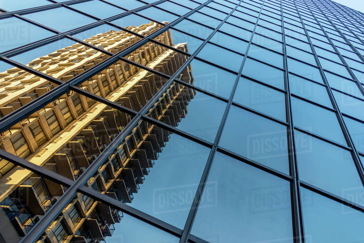 Angled View Of A Skyscraper's Glass Facade From Street Level, Showing ...