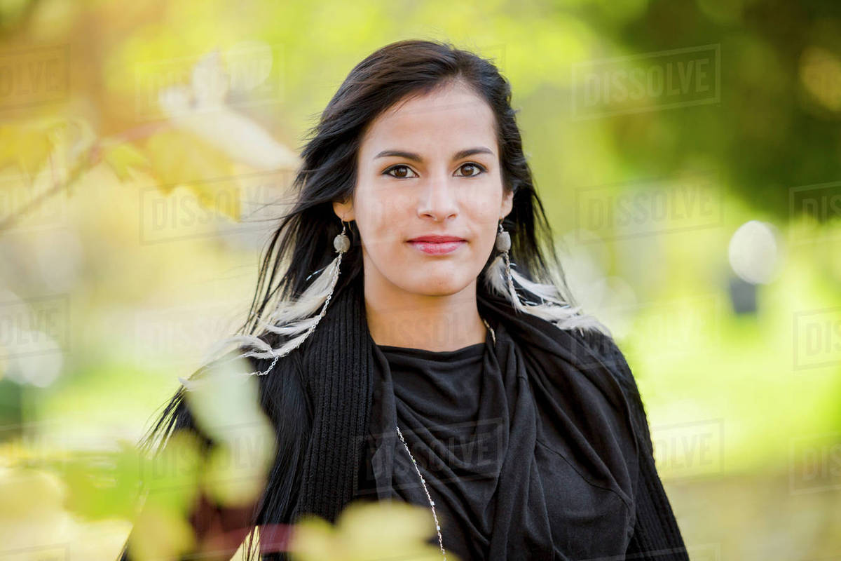 A Young Aboriginal Female Model Looks At The Camera In A Shoulders Up ...
