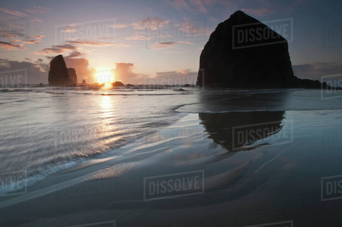 Sunset Behind Haystack Rock; Cannon Beach, Oregon, United States Of ...