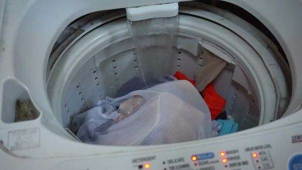 Household appliance - water filling up the tub in a top loading washing ...