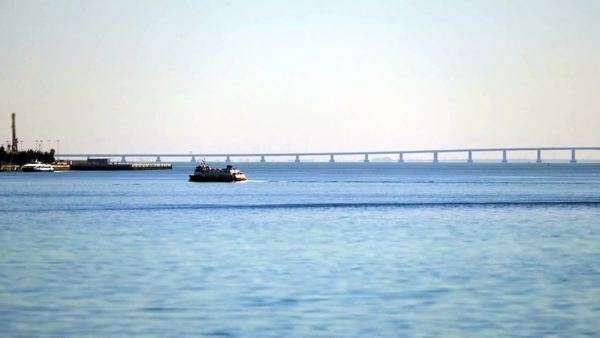 Ferry Crosses the Bay to the background of the Bridge, timelapse ...