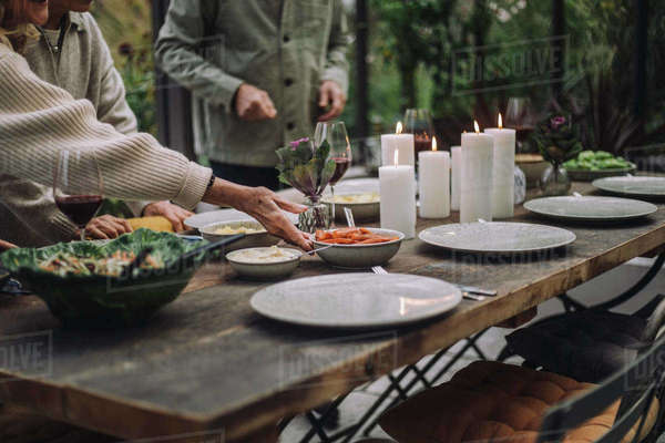 Hand of senior woman preparing dining table for party - Royalty-free ...