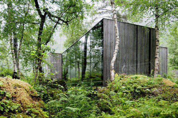 Exterior of hotel in forest - Stock Photo - Dissolve