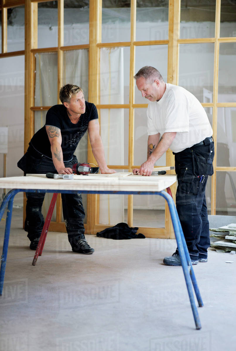 Carpenters working together at workshop - Royalty-free Stock Photo ...