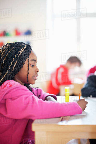 Girl writing with friends in the background - Royalty-free Stock Photo ...
