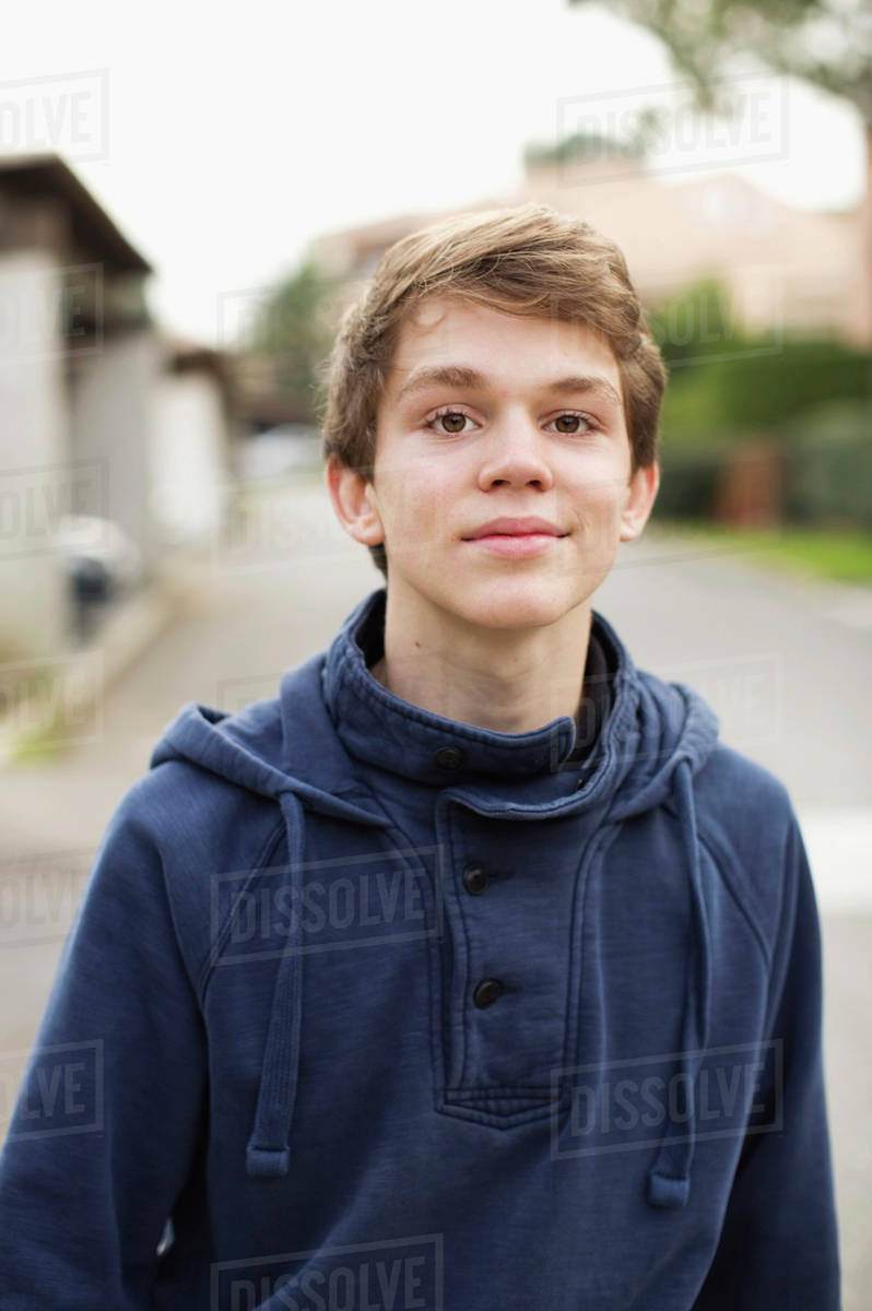 Portrait of young boy standing on street - Royalty-free Stock Photo ...
