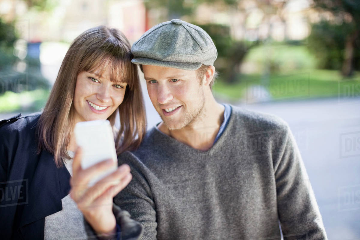 Young couple taking self portrait photography outdoors - Stock Photo ...