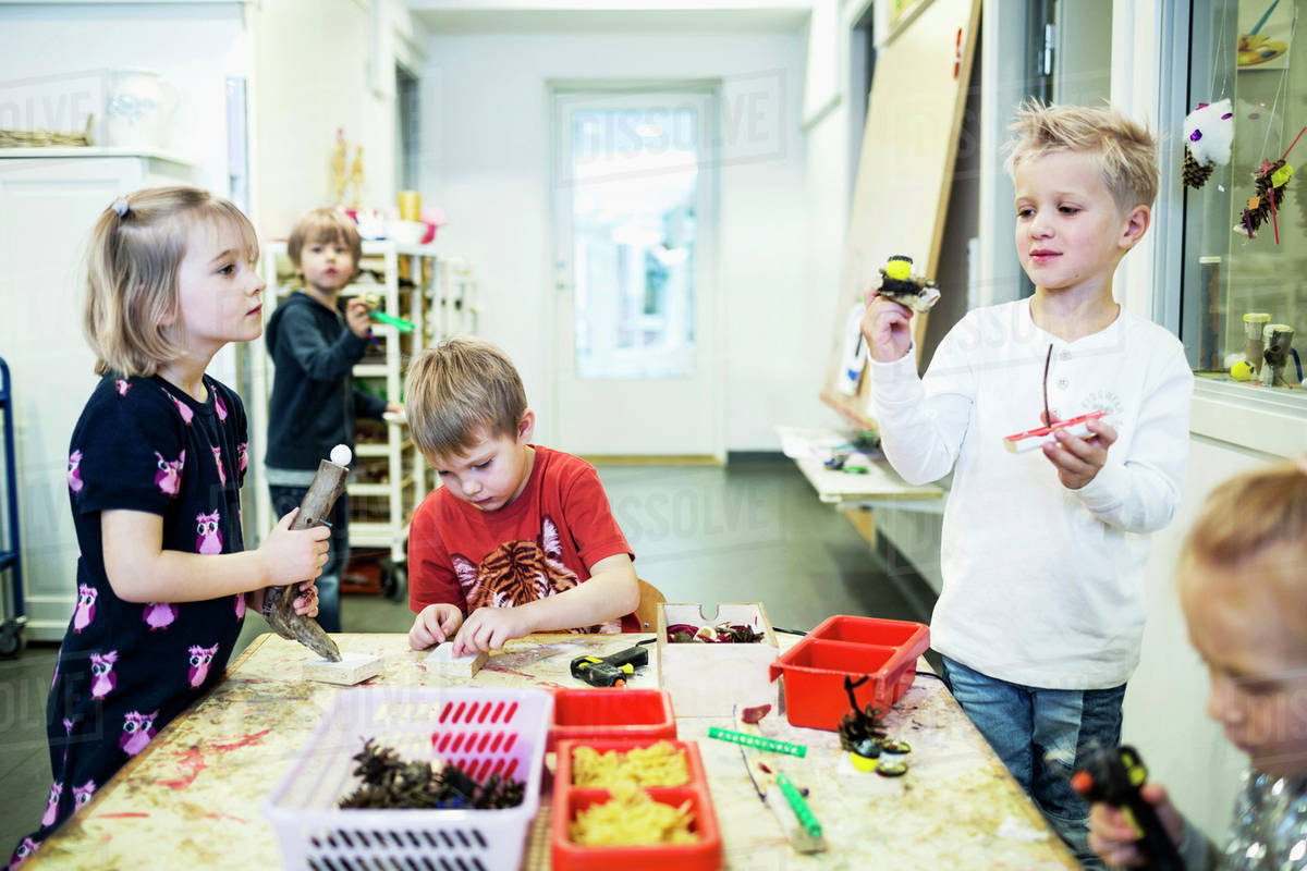 Elementary students in art class at kindergarten - Stock Photo - Dissolve
