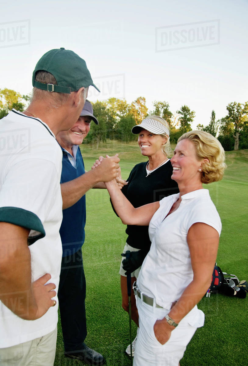 Group of people on golf course - Royalty-free Stock Photo | Dissolve