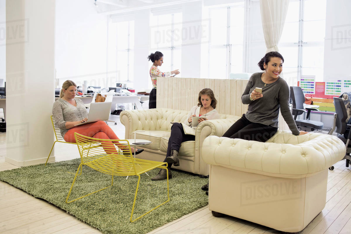 Creative businesswomen doing various activities in office - Royalty ...