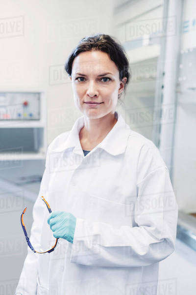 Portrait of confident female scientist standing at laboratory - Royalty ...
