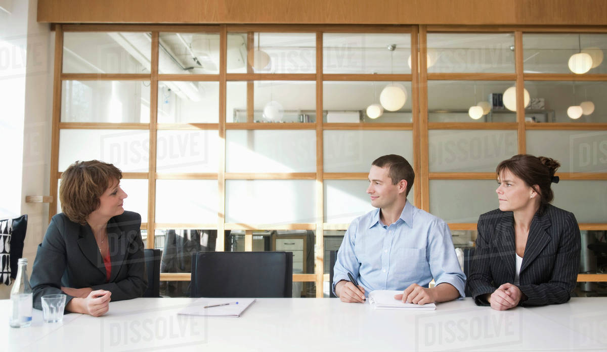 Three people in meeting - Stock Photo - Dissolve